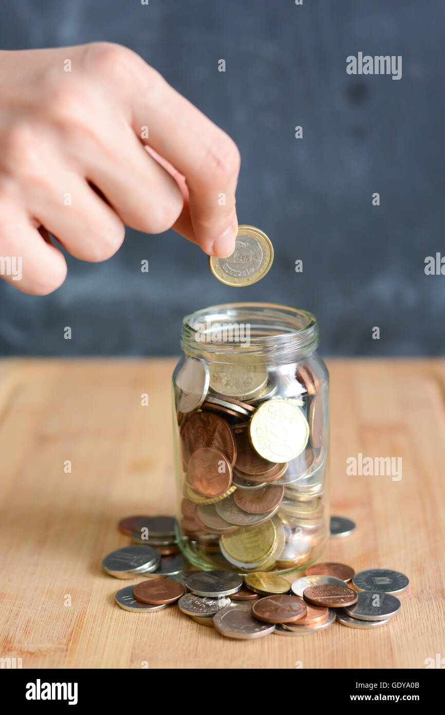 Money jar savings woman hi-res stock photography and images - Alamy