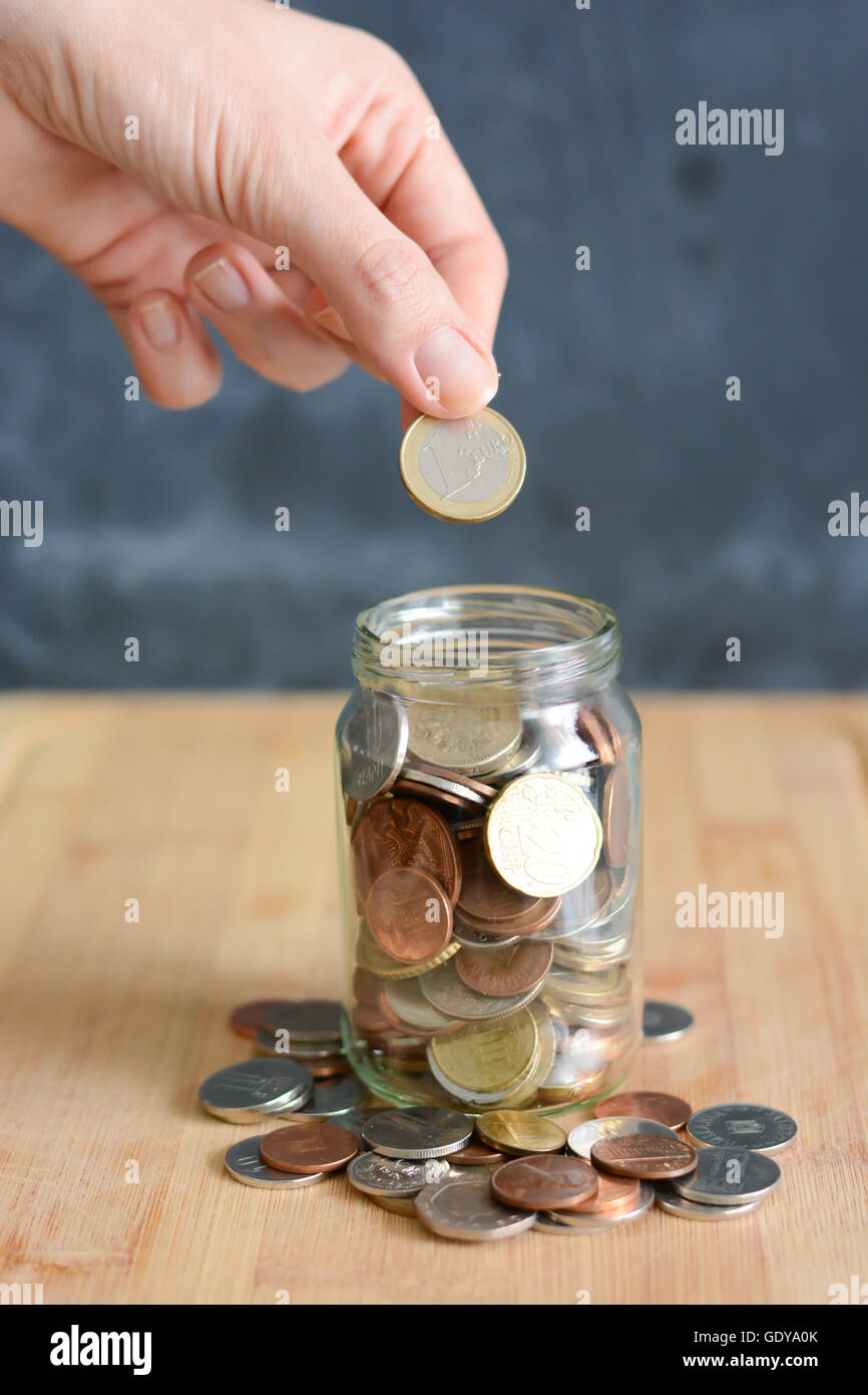 Money jar savings woman hi-res stock photography and images - Alamy