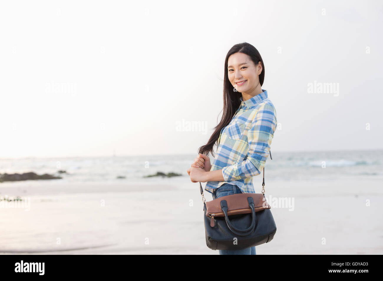 Young woman side view beach hi-res stock photography and images - Alamy