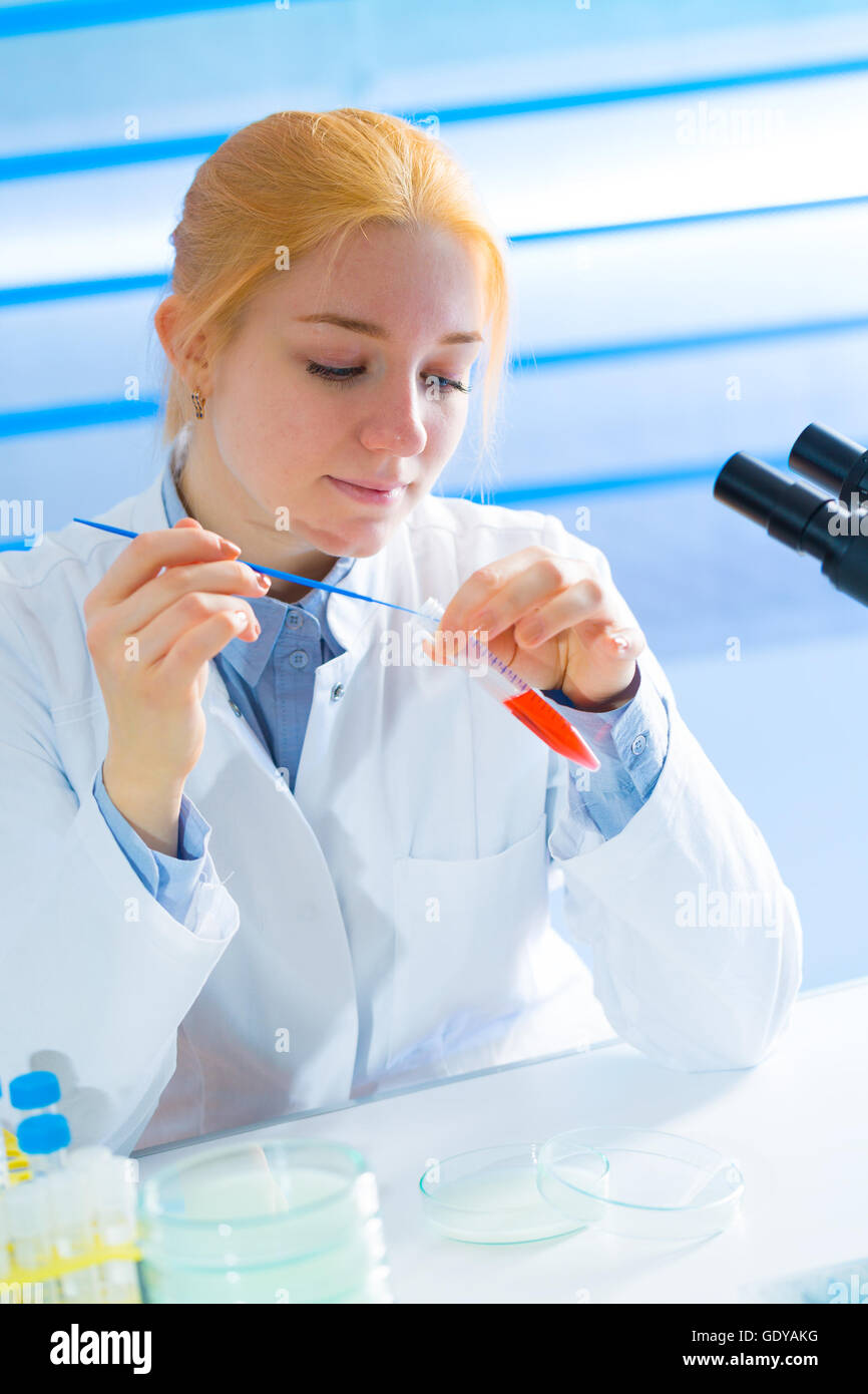 A female medical or scientific researcher or woman doctor take sample ...