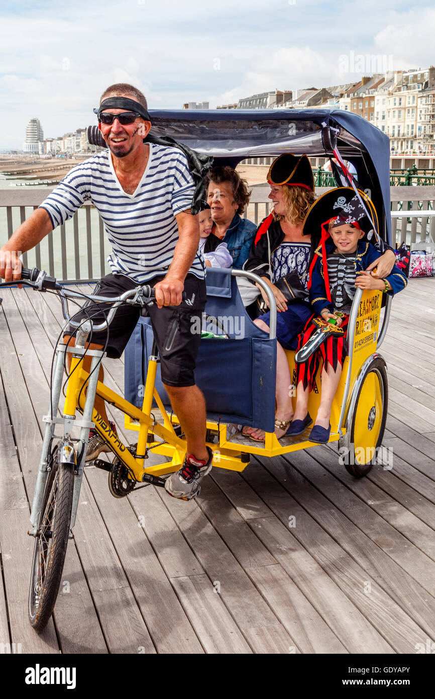 A Family Dressed In Pirate Costume Take A Rickshaw Ride On Hastings ...