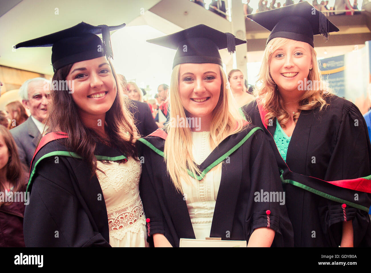 Higher Education in the UK: Three young happy smiling women female girl ...