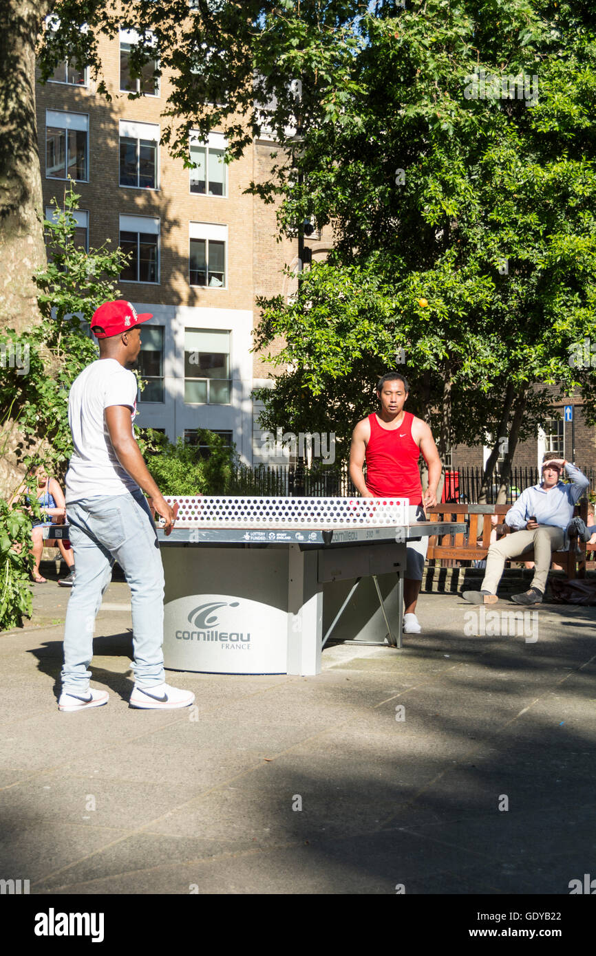 Two men playing ping pong outside hi-res stock photography and images ...
