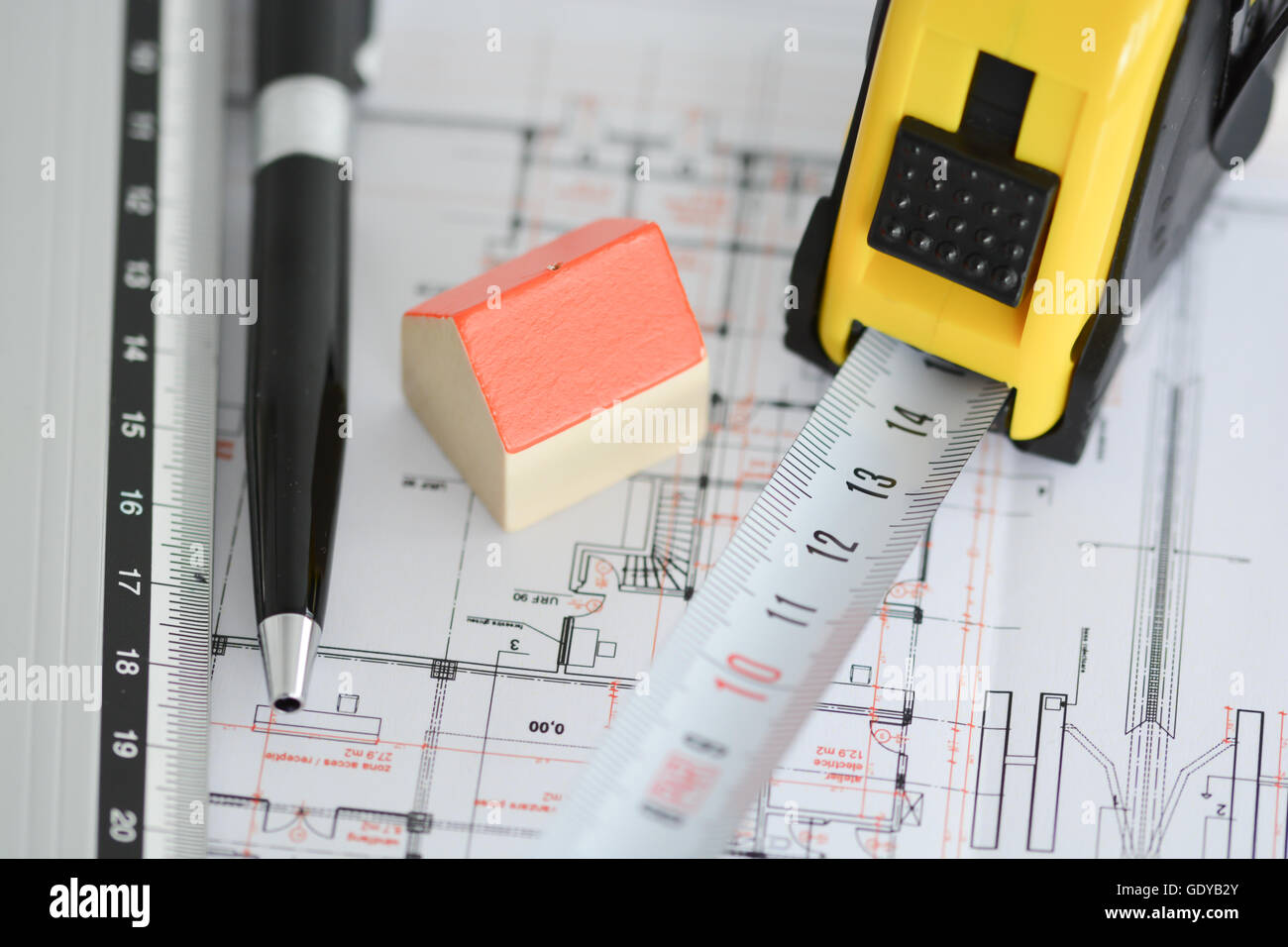 Architecture plans of a building with Small model house on top of ...