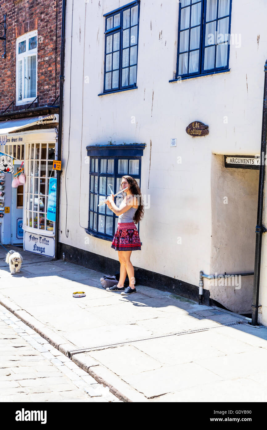 Girl playing flute hi-res stock photography and images - Alamy