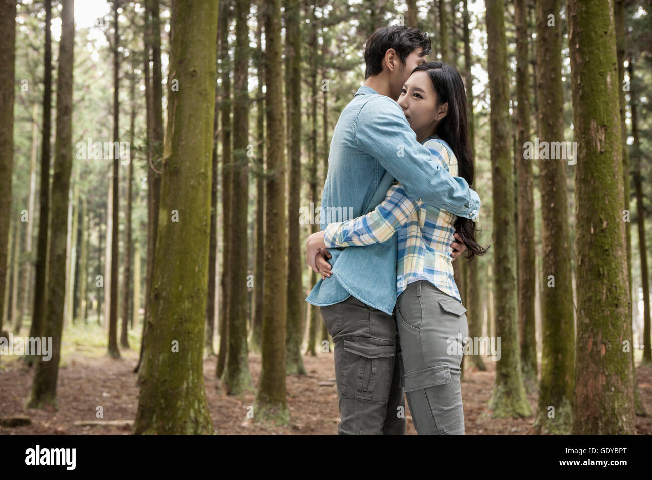 Hugging couple smiling standing hi-res stock photography and images - Alamy