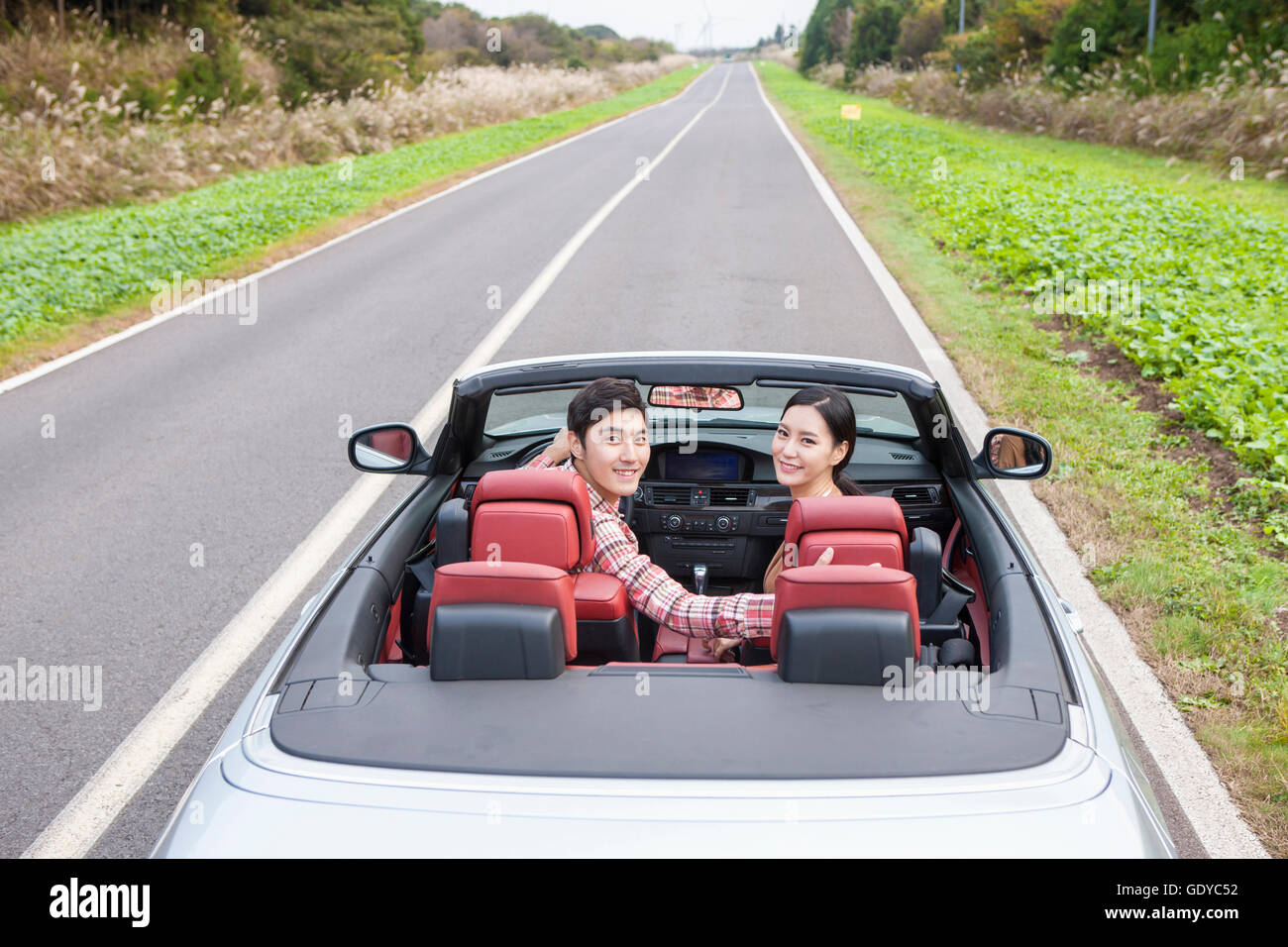 Side view portrait of young smiling couple in a car looking back Stock ...