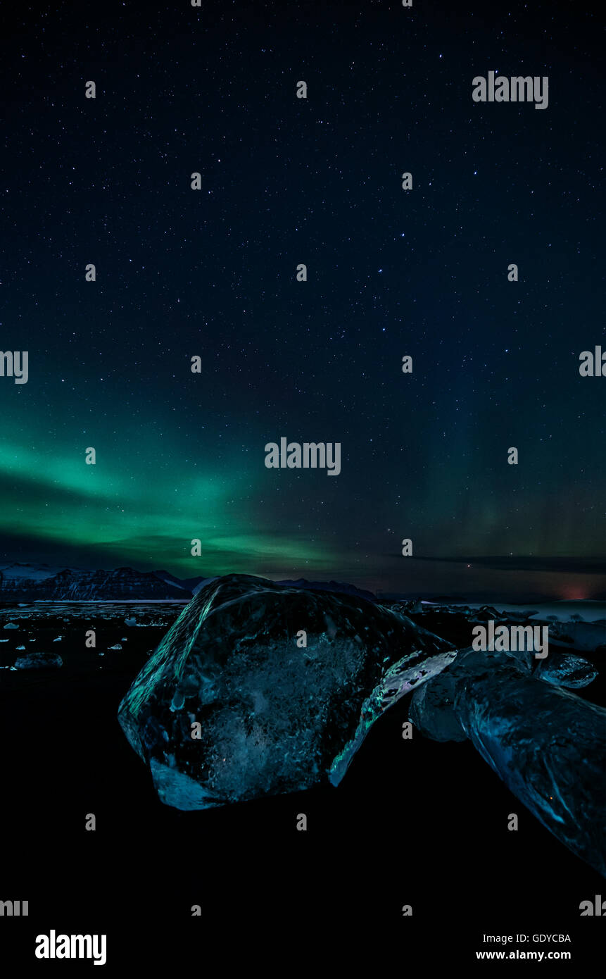 Northern lights over icy night landscape and Jokulsarlon glacier ...