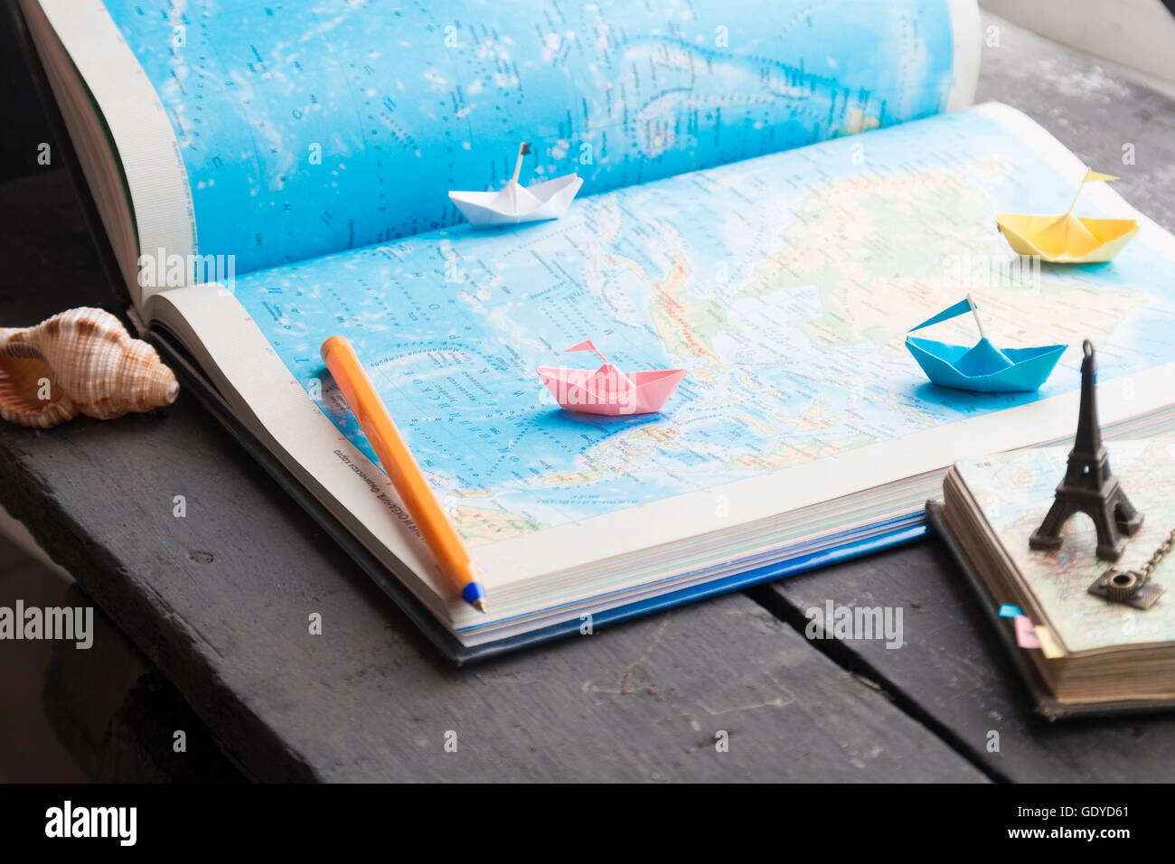 Go on an adventure. Preparing for the journey. Paper boats on the map ...