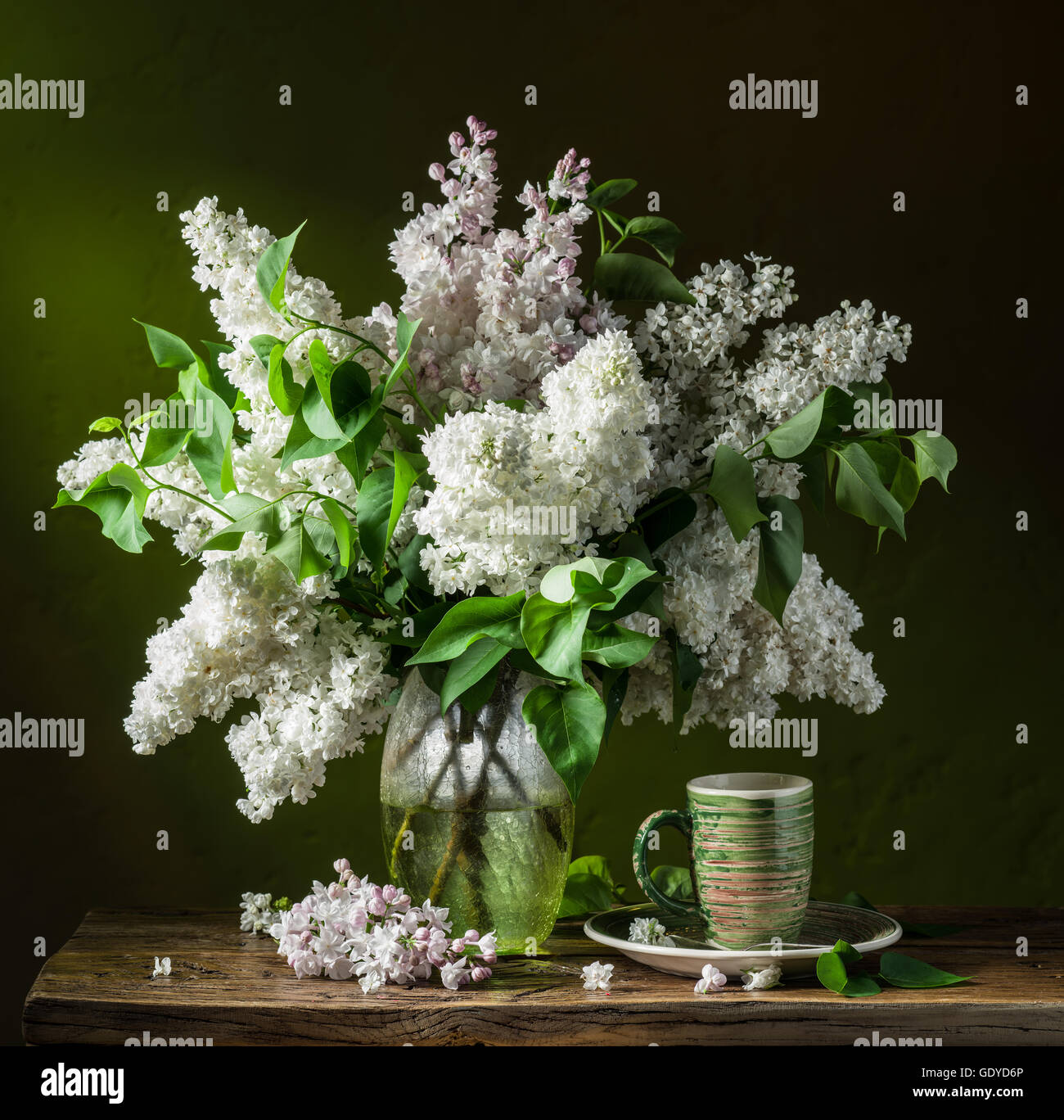 Lilac bouquet on the wooden table Stock Photo - Alamy