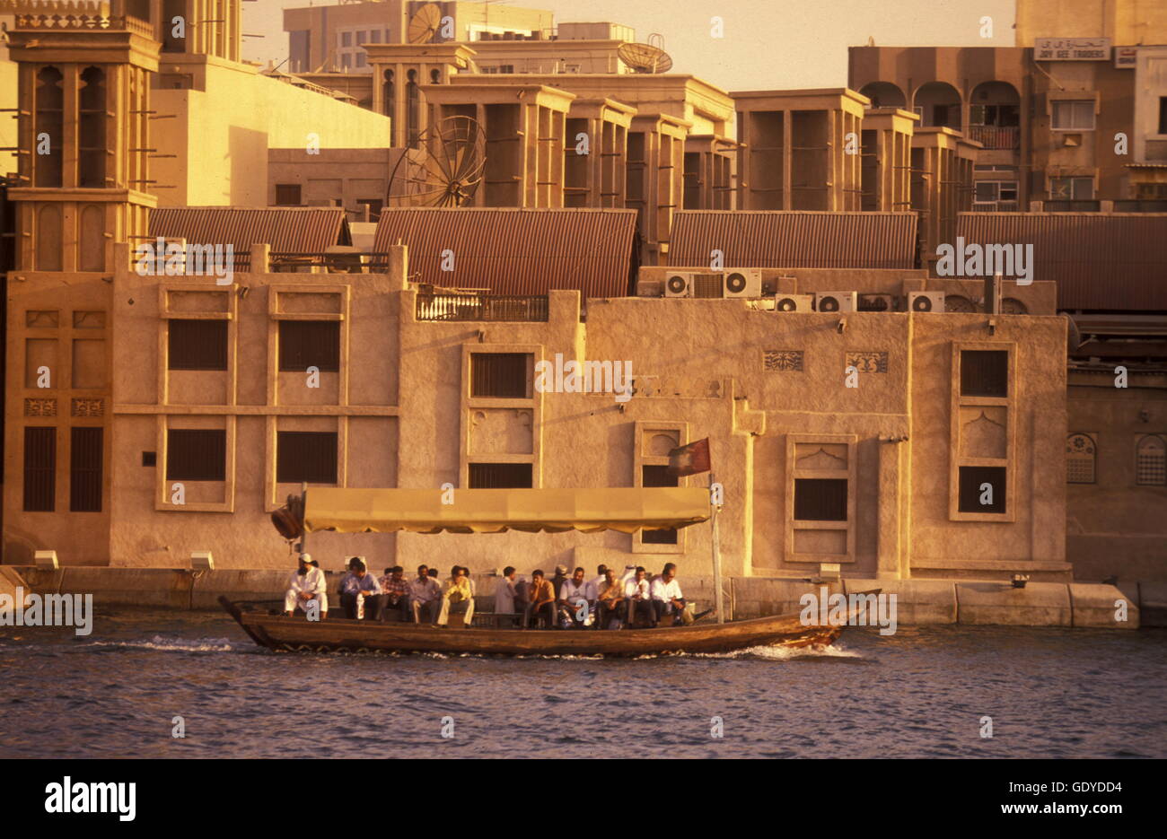 a city boat and ferry on the Dubai creek in the old town in the city of ...