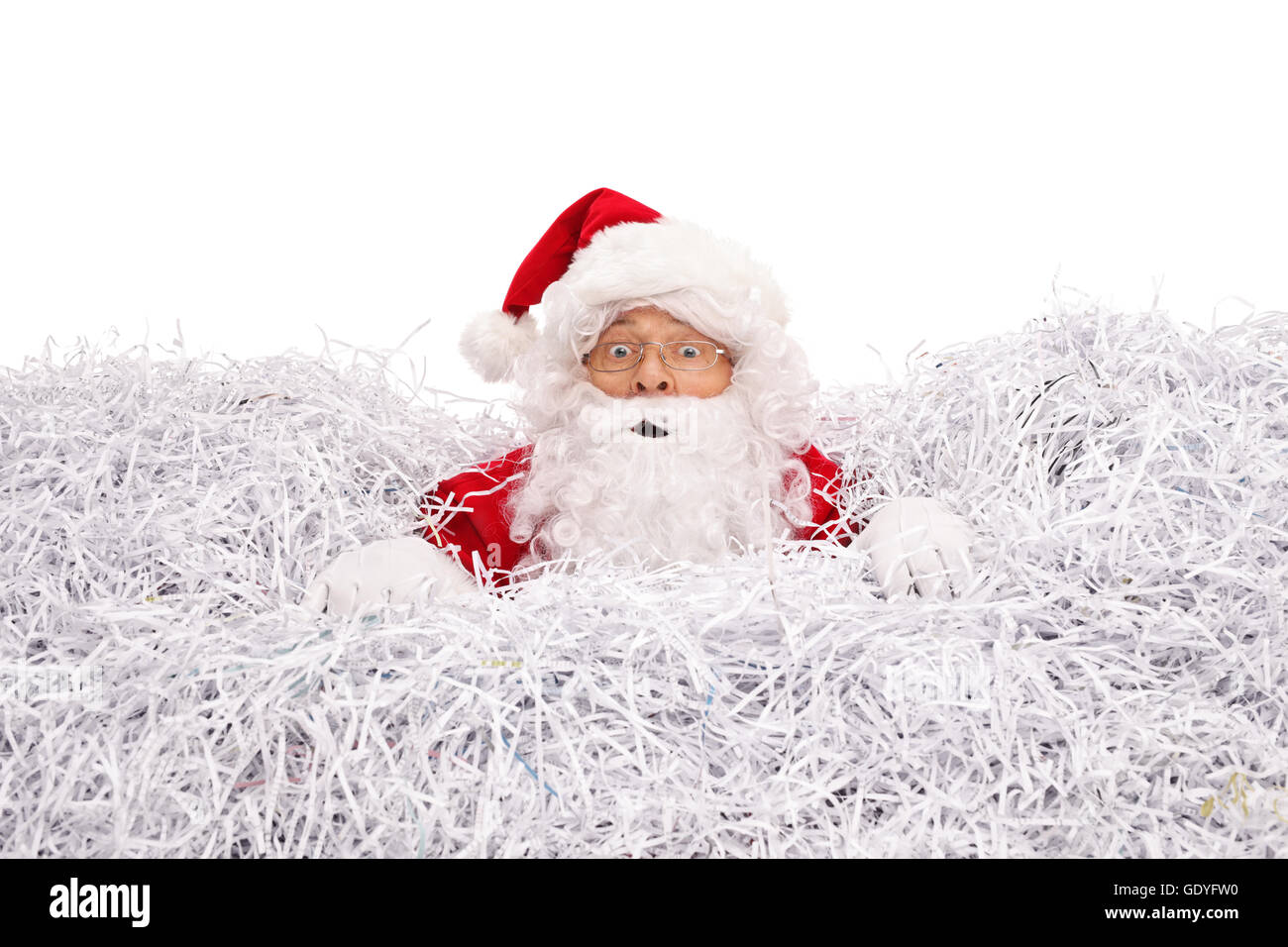 Confused Santa Claus drowning in a pile of shredded paper isolated on ...