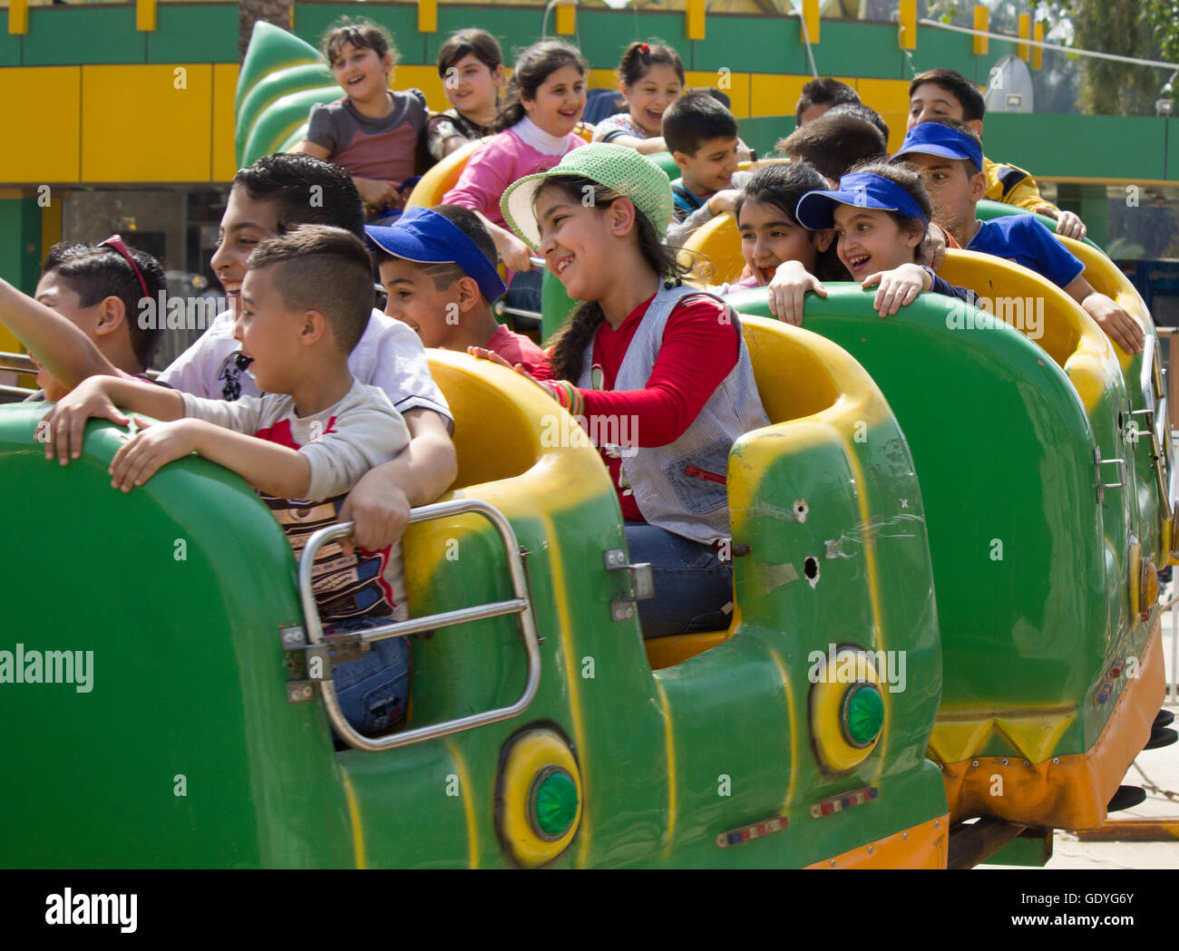 Iraqi kids riding some games in Zawraa park in Baghdad city capital of ...