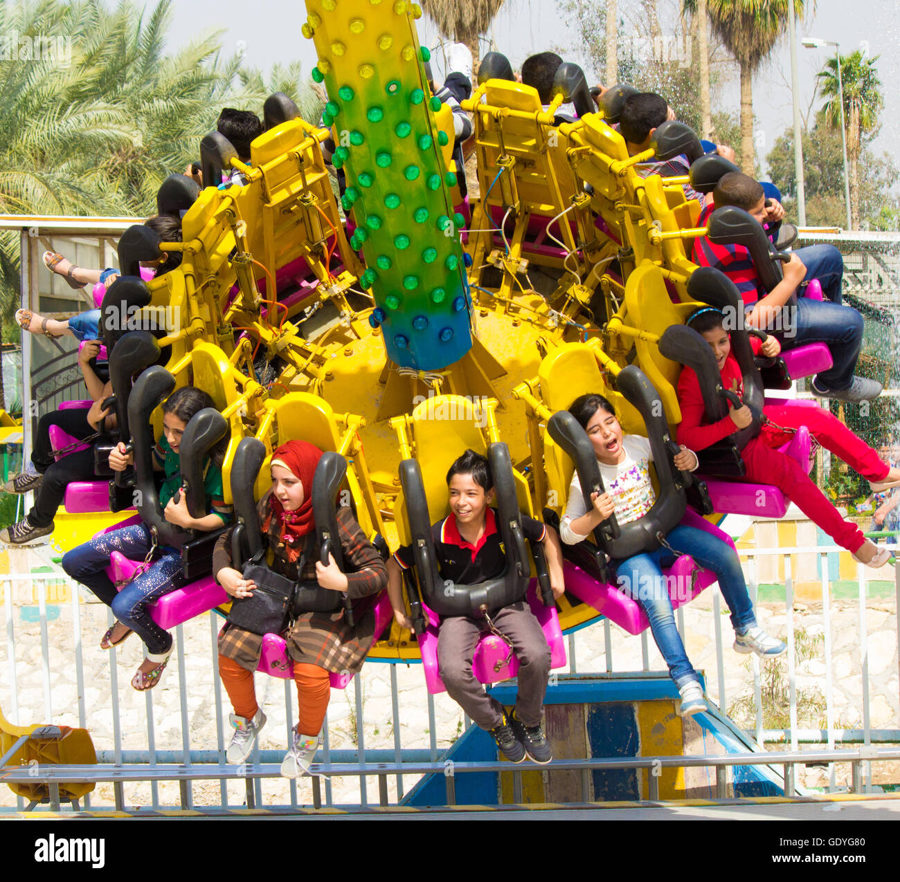 Iraqi kids riding some games in Zawraa park in Baghdad city capital of ...