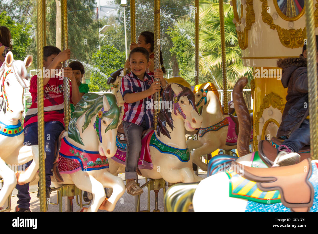 Iraqi kids riding some games in Zawraa park in Baghdad city capital of ...
