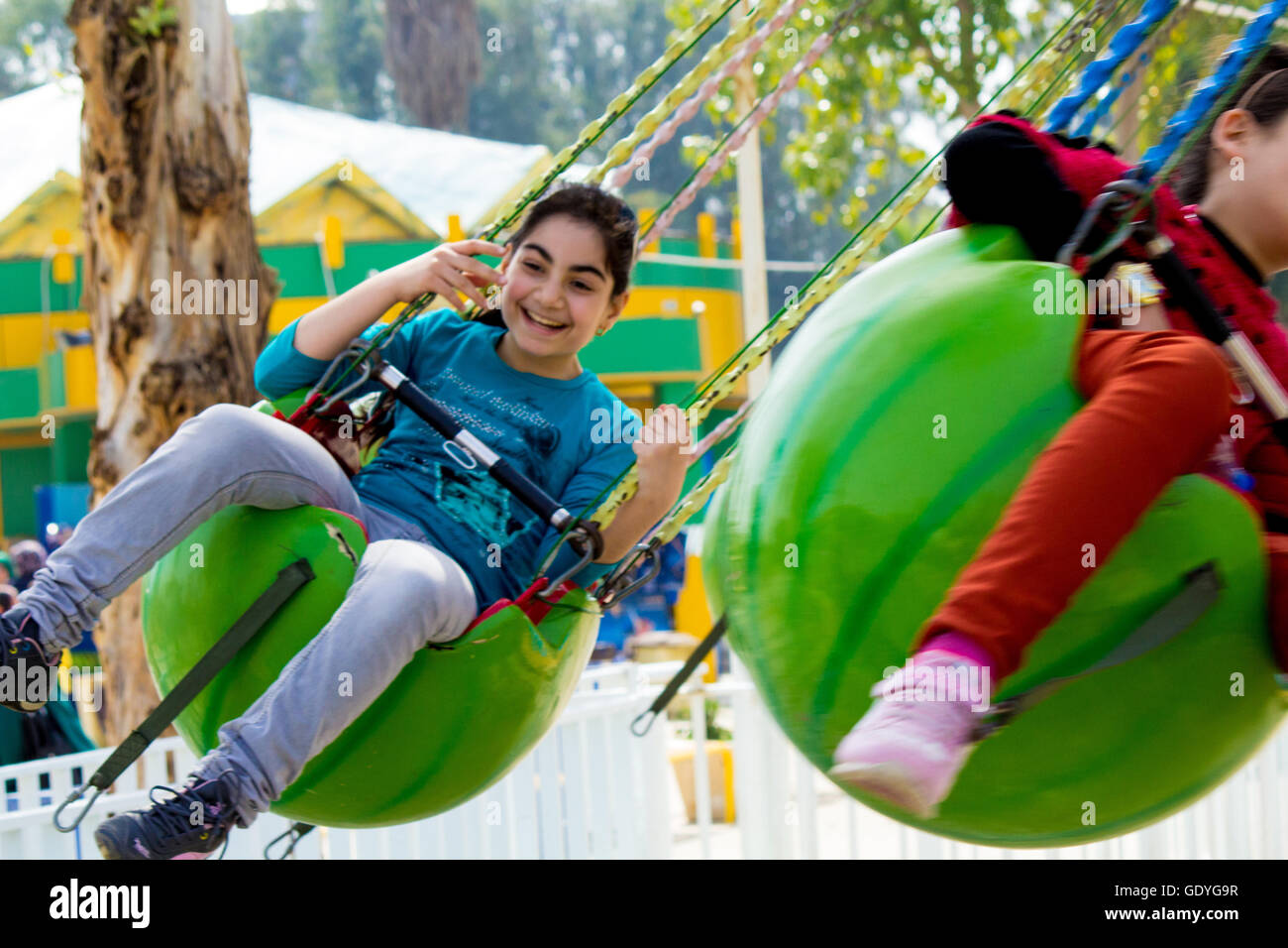 Iraqi kids riding some games in Zawraa park in Baghdad city capital of ...