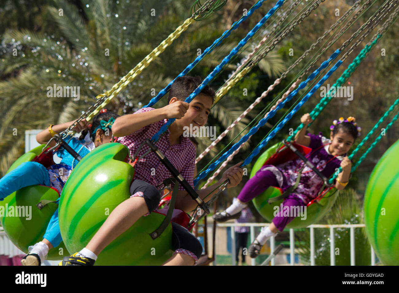 Iraqi kids riding some games in Zawraa park in Baghdad city capital of ...