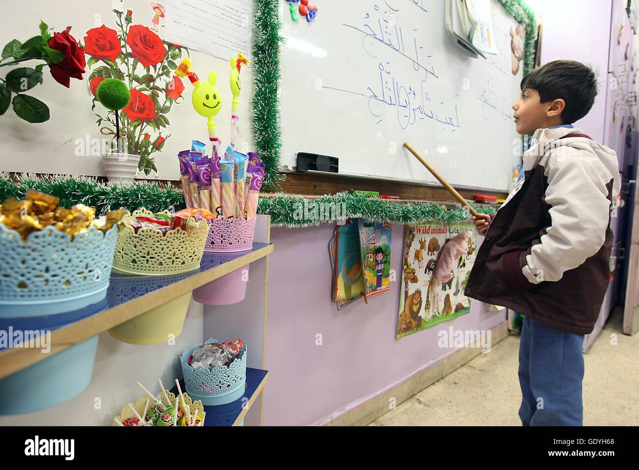 In a school in Amman, capital of Jordan. A pupil is in the classroom on ...