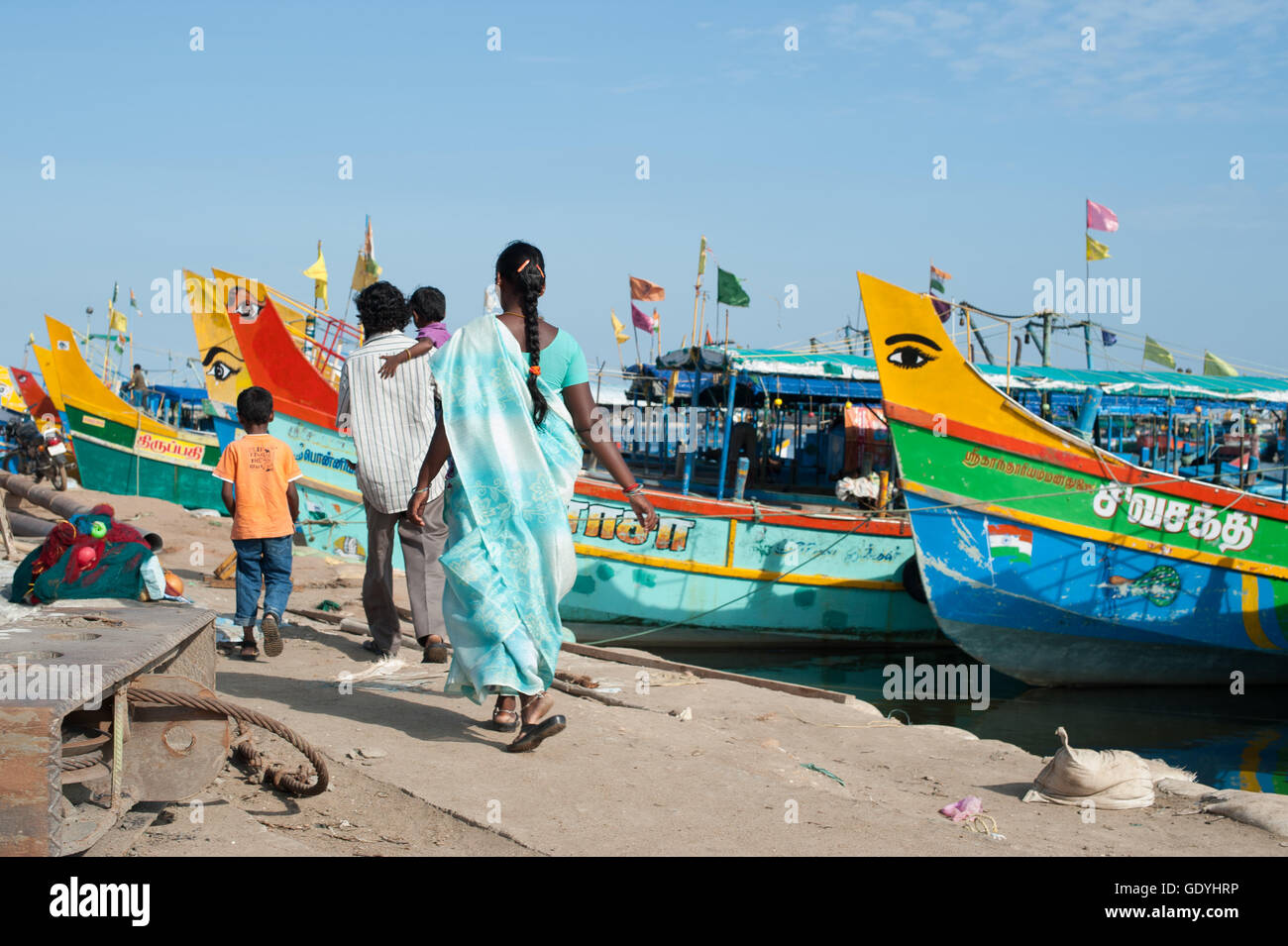 A family is walking along the harbor in Puducherry, India, on 11 ...
