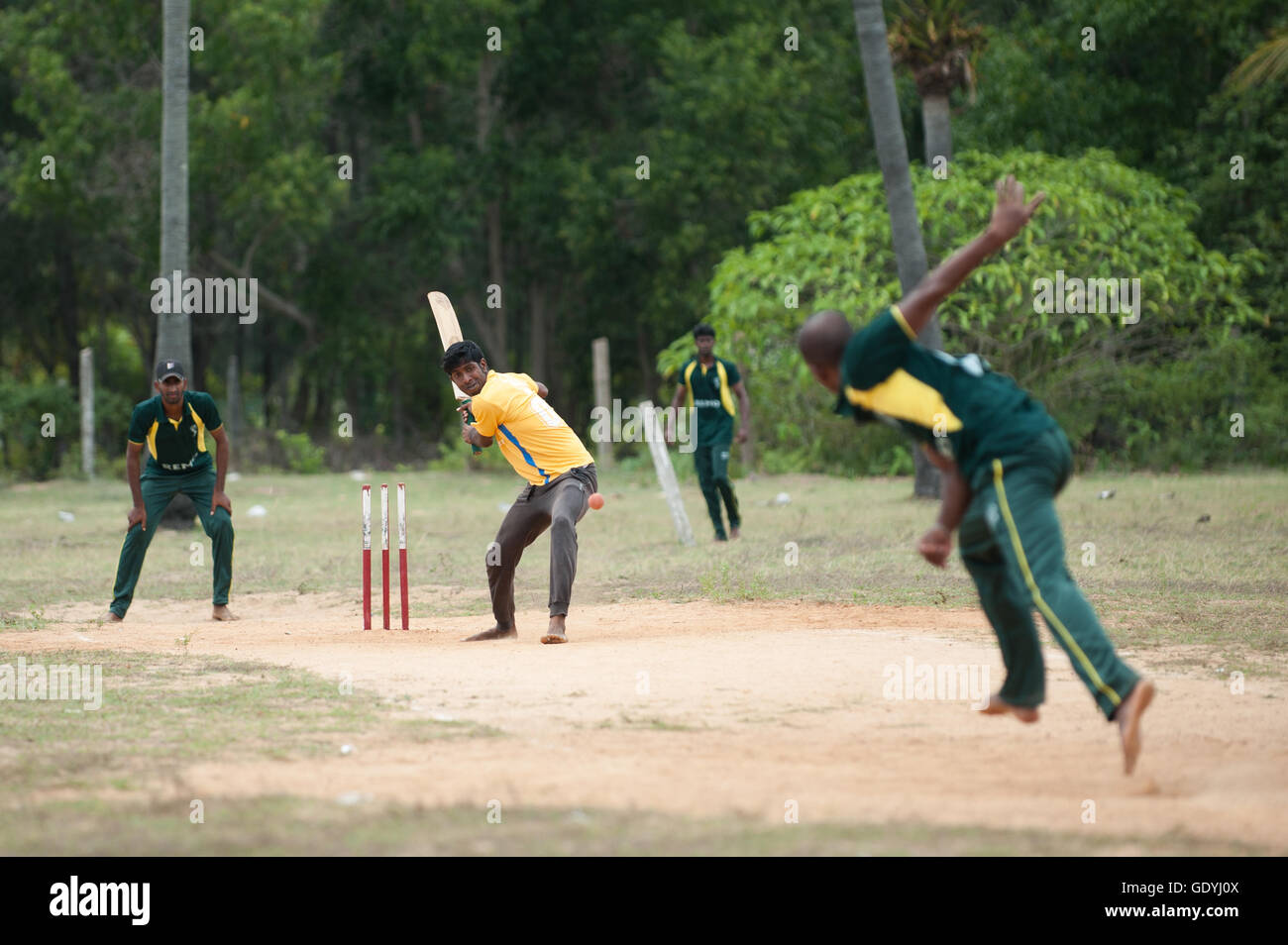 Young men are playing cricket near Mahabalipuram, India, on 11 October ...