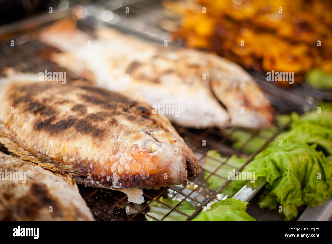 Fresh grilled whole red snapper fish in sea salt. Traditional thai ...