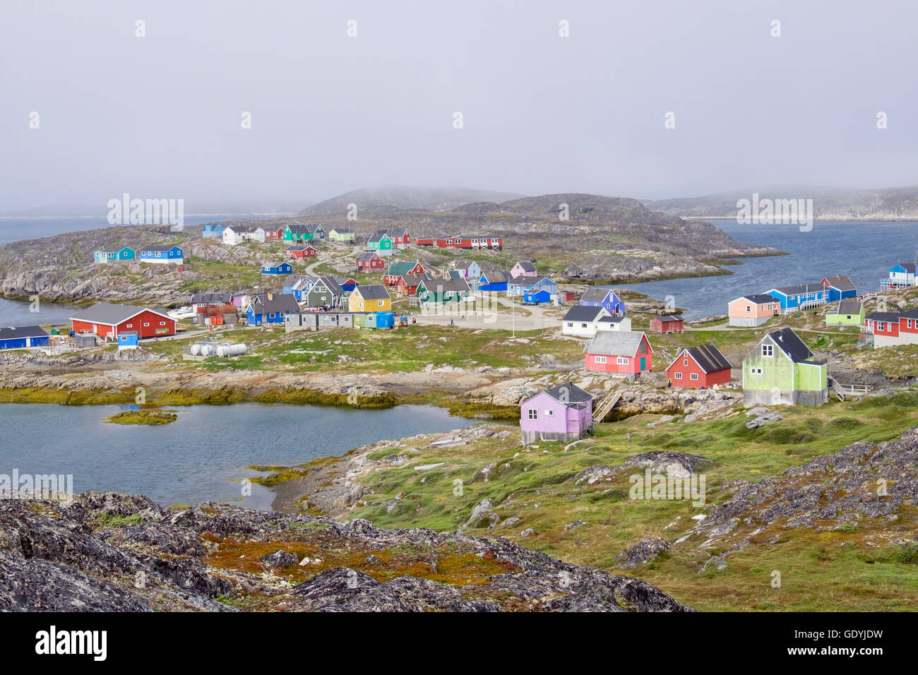 Colourful painted traditional Inuit houses in small island settlement ...