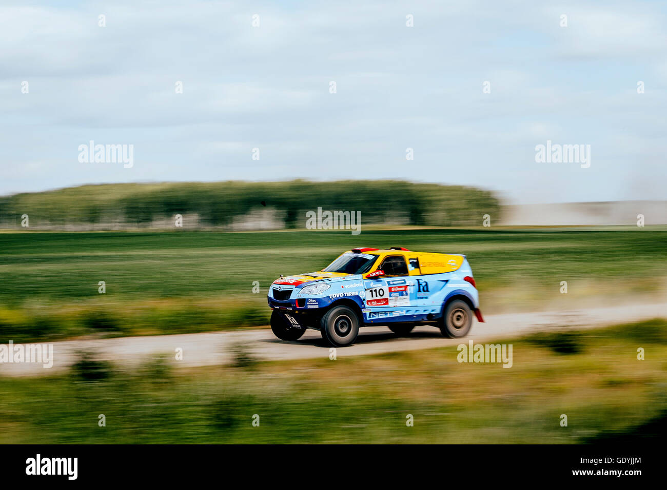 rally car rides at high speed on a dusty road during Silk way rally ...