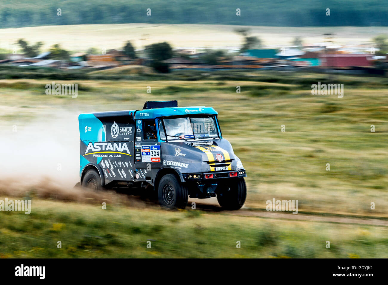 rally truck rides at high speed on a dusty road during Silk way rally ...