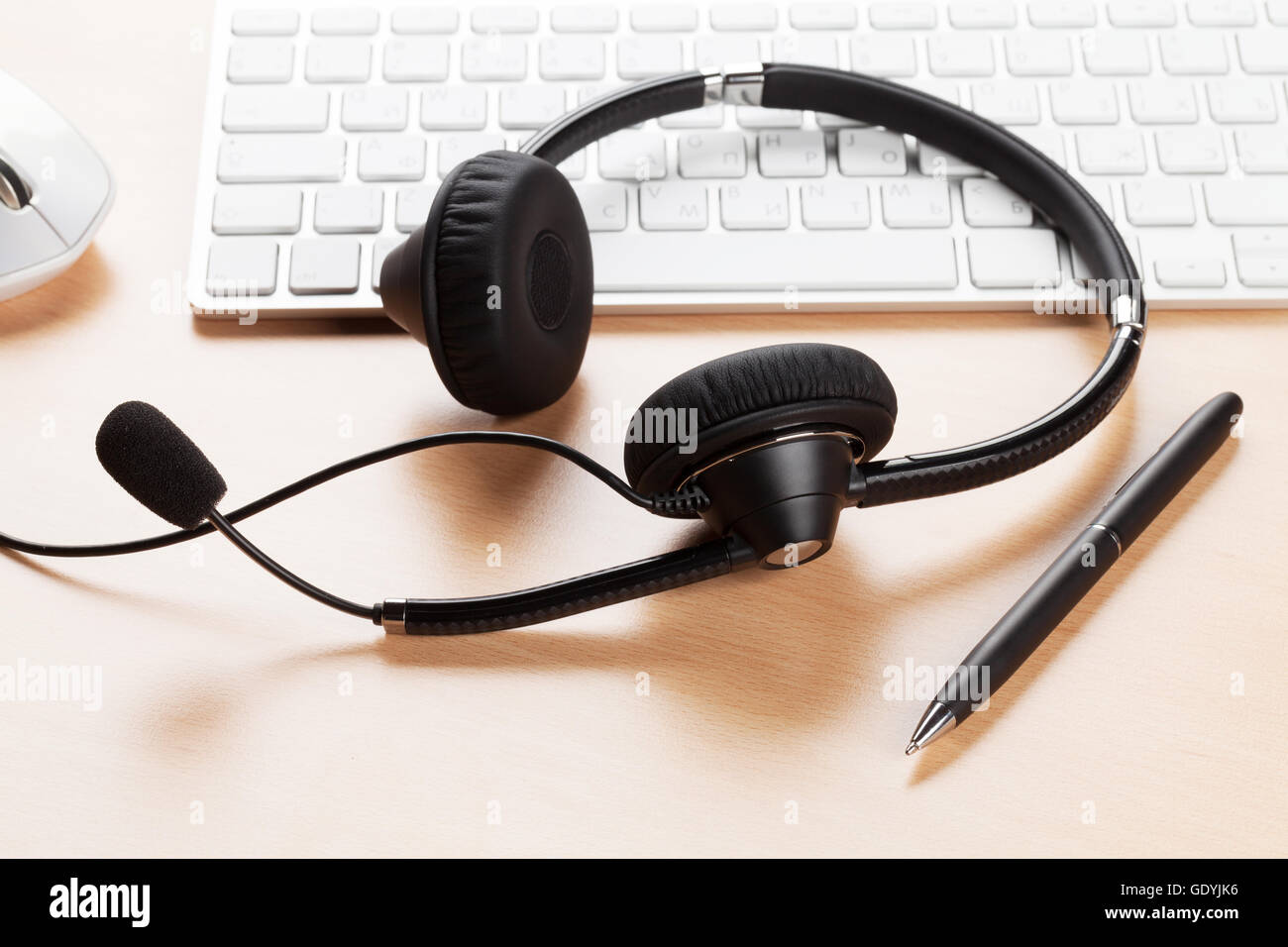 Office desk with headset and pc. Call center support table Stock Photo ...