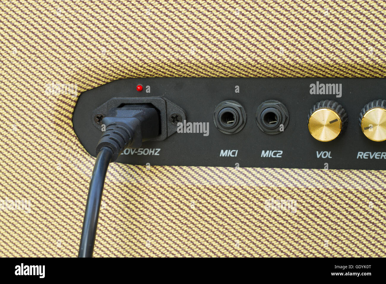 Insert the power plug of amplifier Stock Photo - Alamy