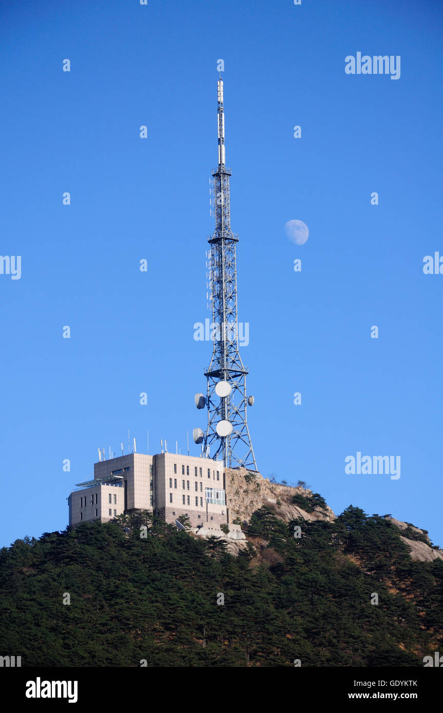 A waxing moon and radio tower on top of Bright peak in the Yellow ...