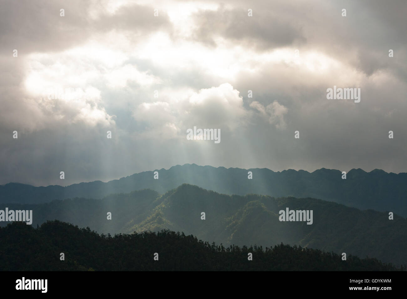 Light rays over mountain landscape china Stock Photo - Alamy