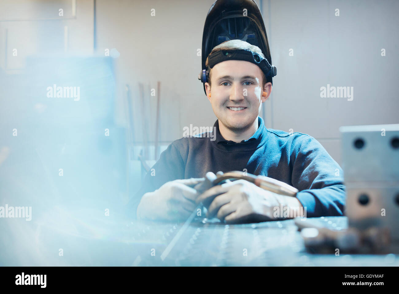 Portrait smiling welder in steel factory Stock Photo - Alamy
