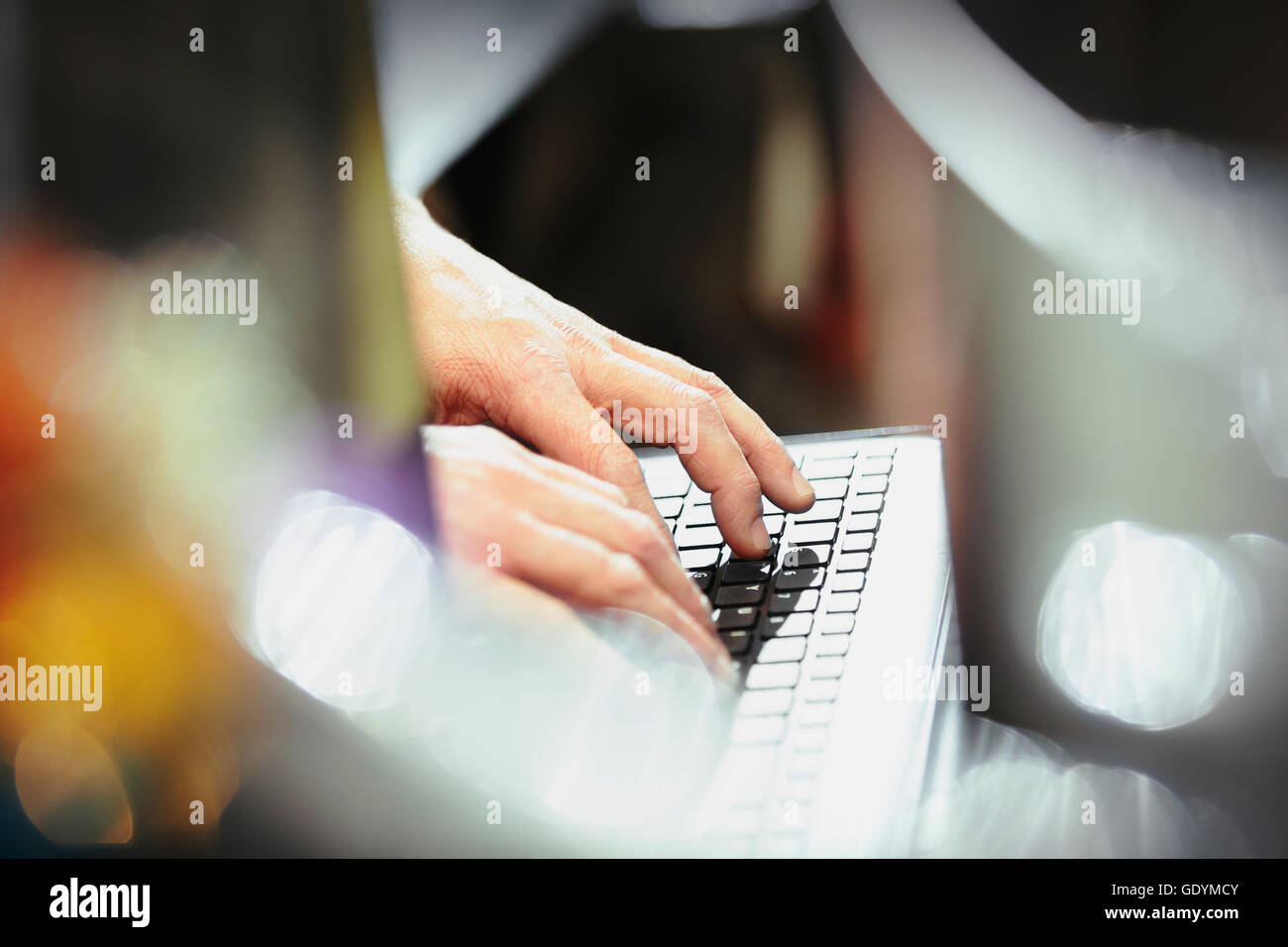 Worker typing on computer keyboard in steel factory Stock Photo - Alamy