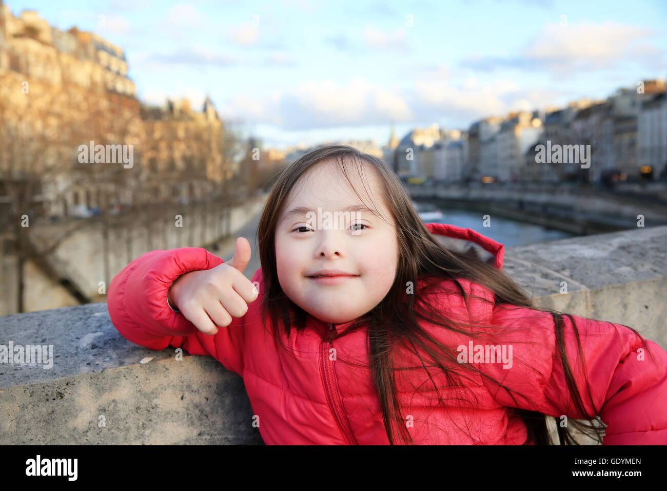 Portrait of little girl smiling in Paris Stock Photo - Alamy
