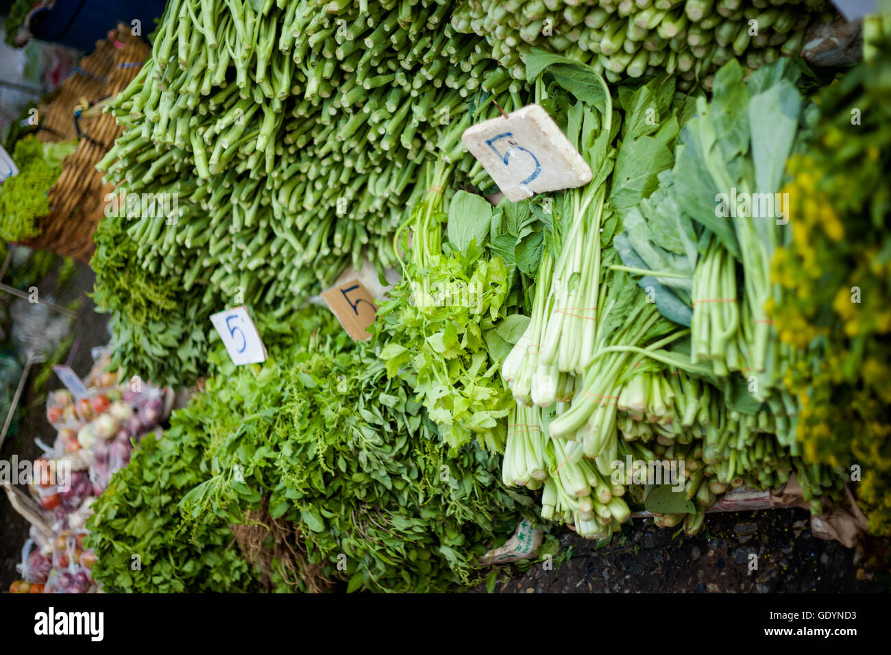 Selection of fresh green herbs and vegetables. Traditional thai market ...