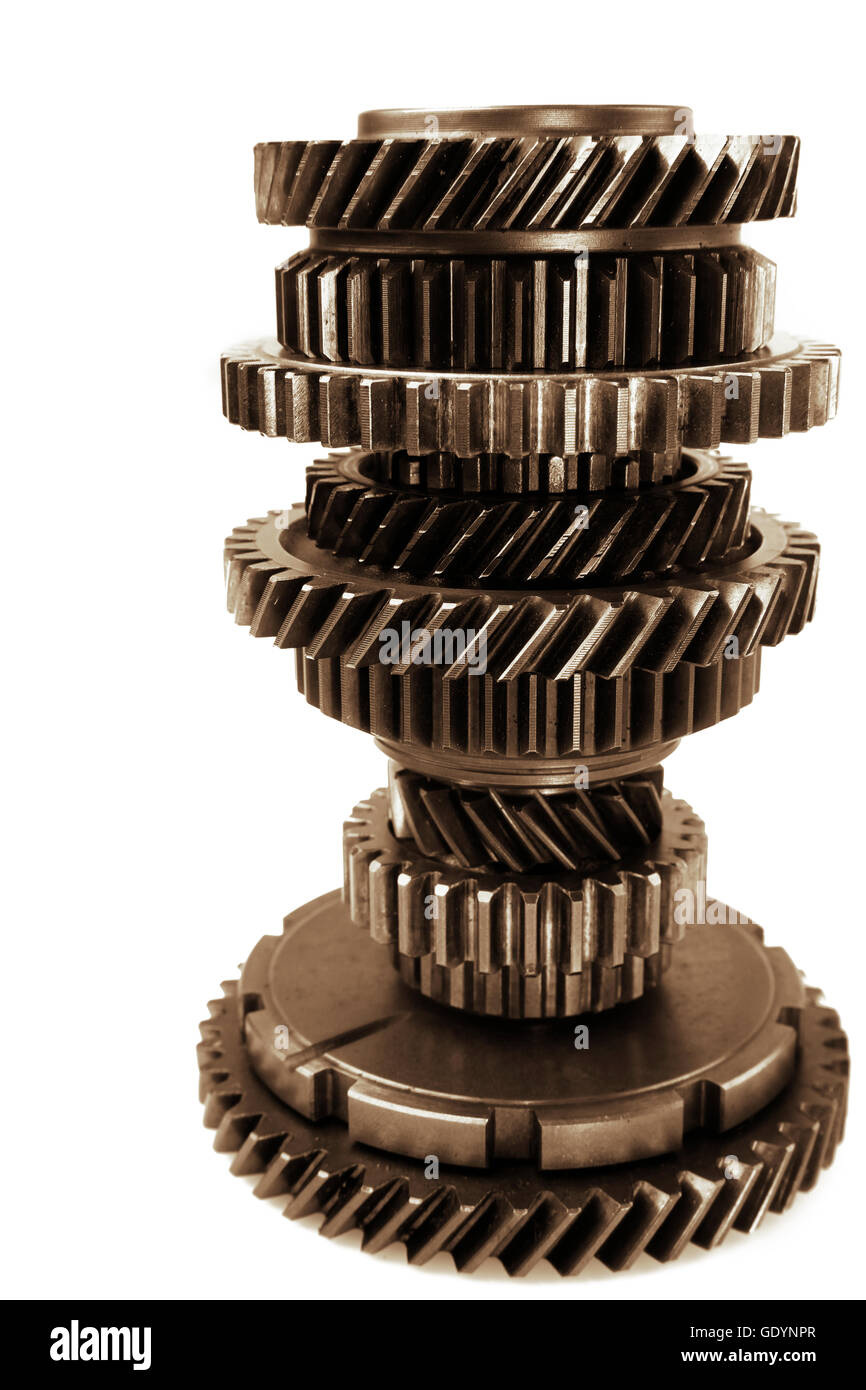 Steel cogs together on plain background Stock Photo - Alamy