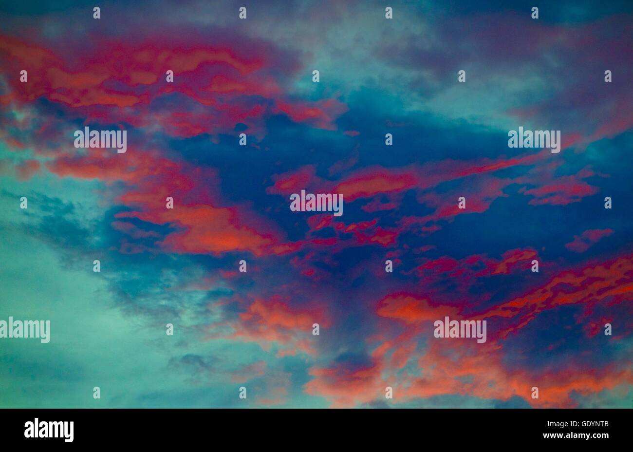 Red and blue clouds on a warm summer evening, from a sunset Stock Photo ...