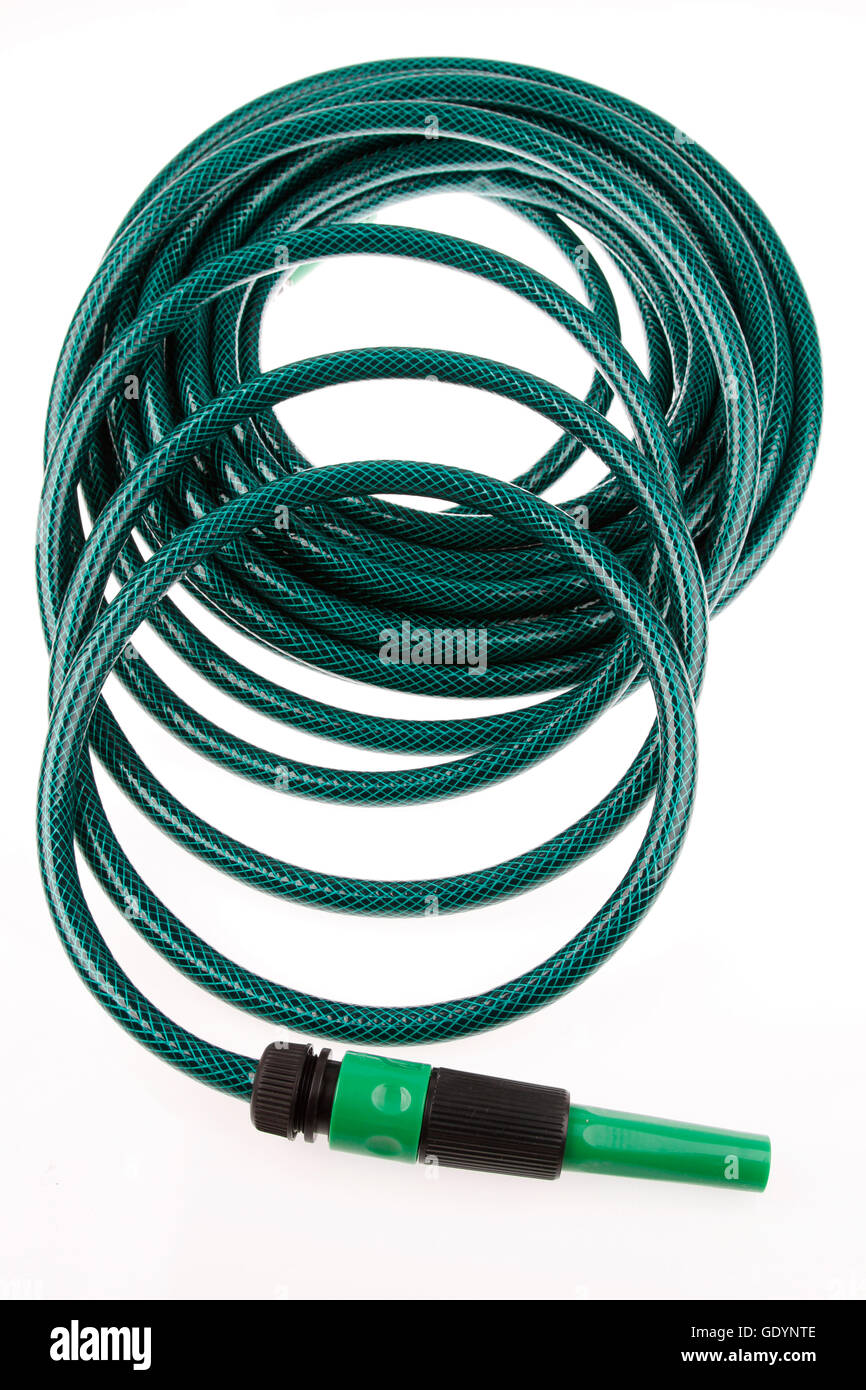 Garden hose coiled on plain background Stock Photo - Alamy