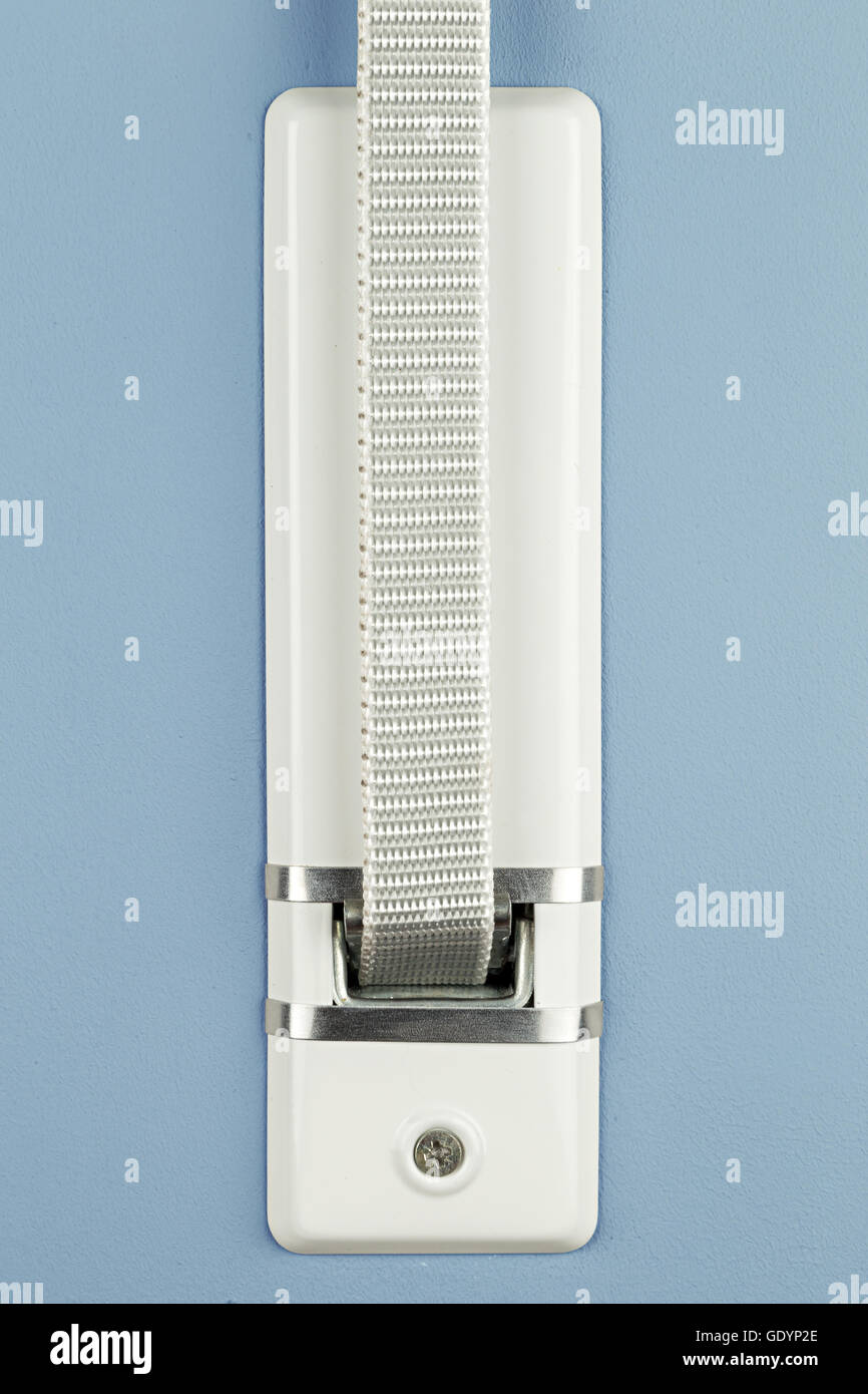 shutter belt on blue wall Stock Photo - Alamy
