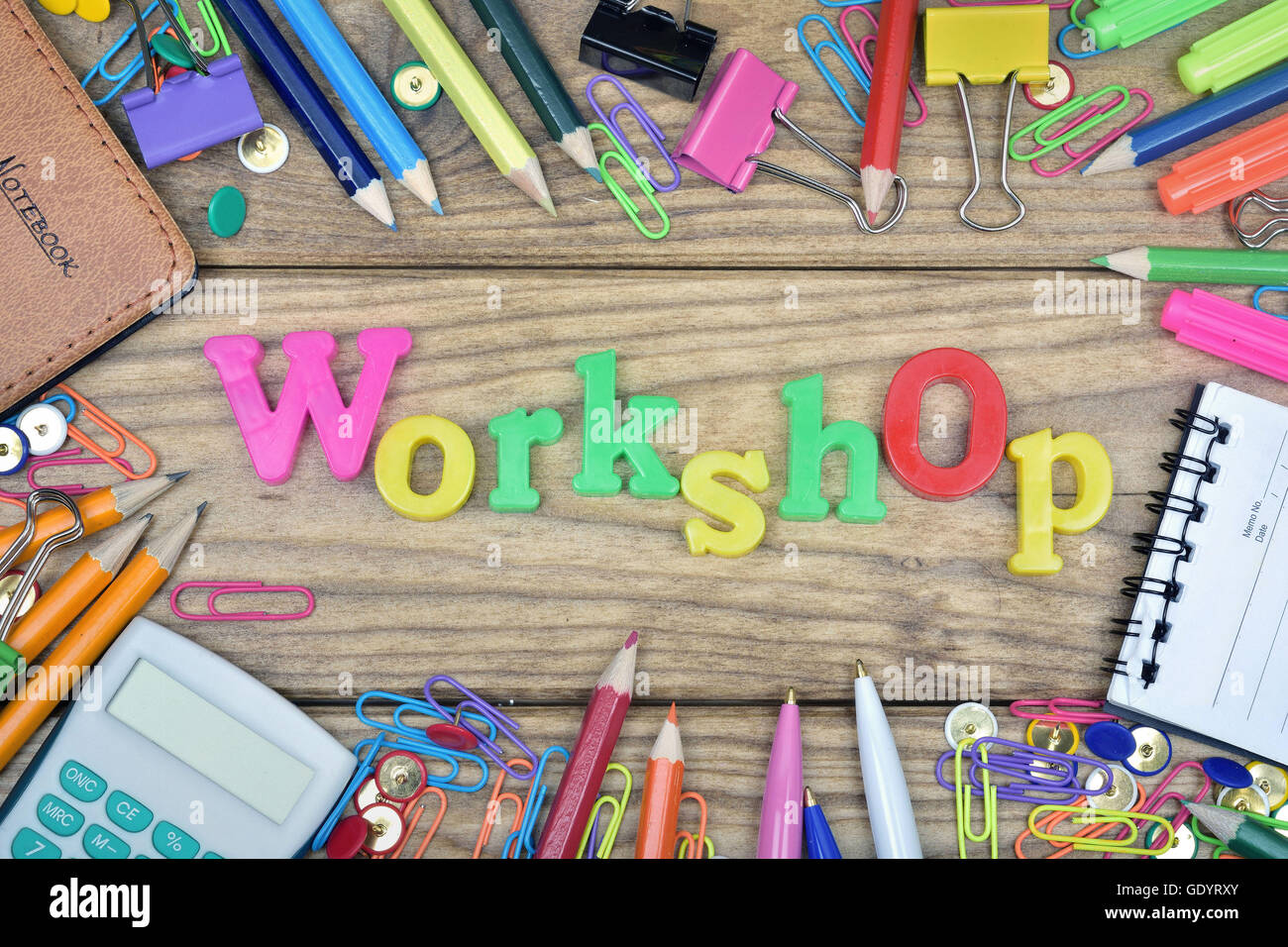 Workshop word and office tools on wooden table Stock Photo - Alamy