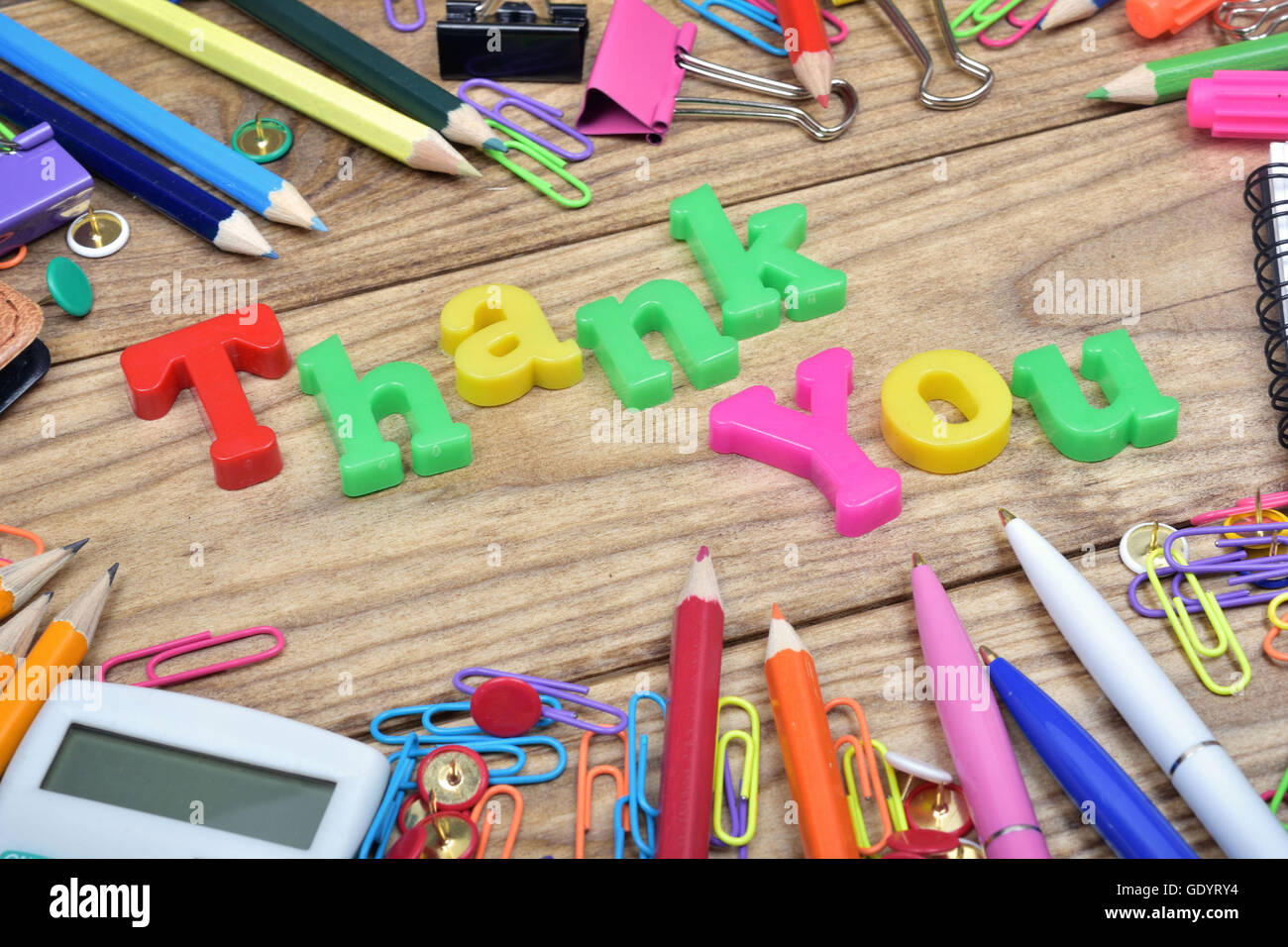 Thank You word and office tools on wooden table Stock Photo - Alamy