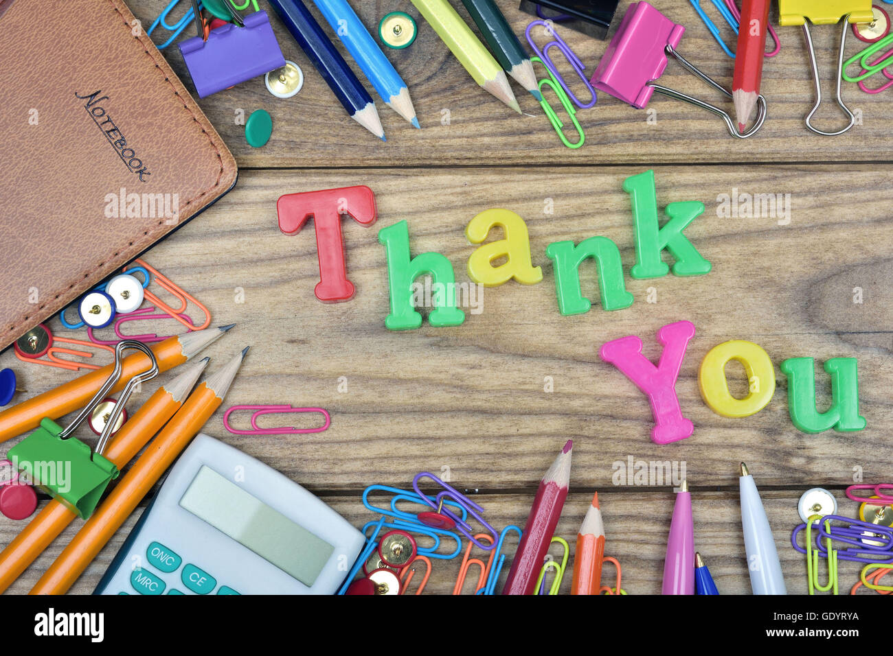 Thank You word and office tools on wooden table Stock Photo - Alamy
