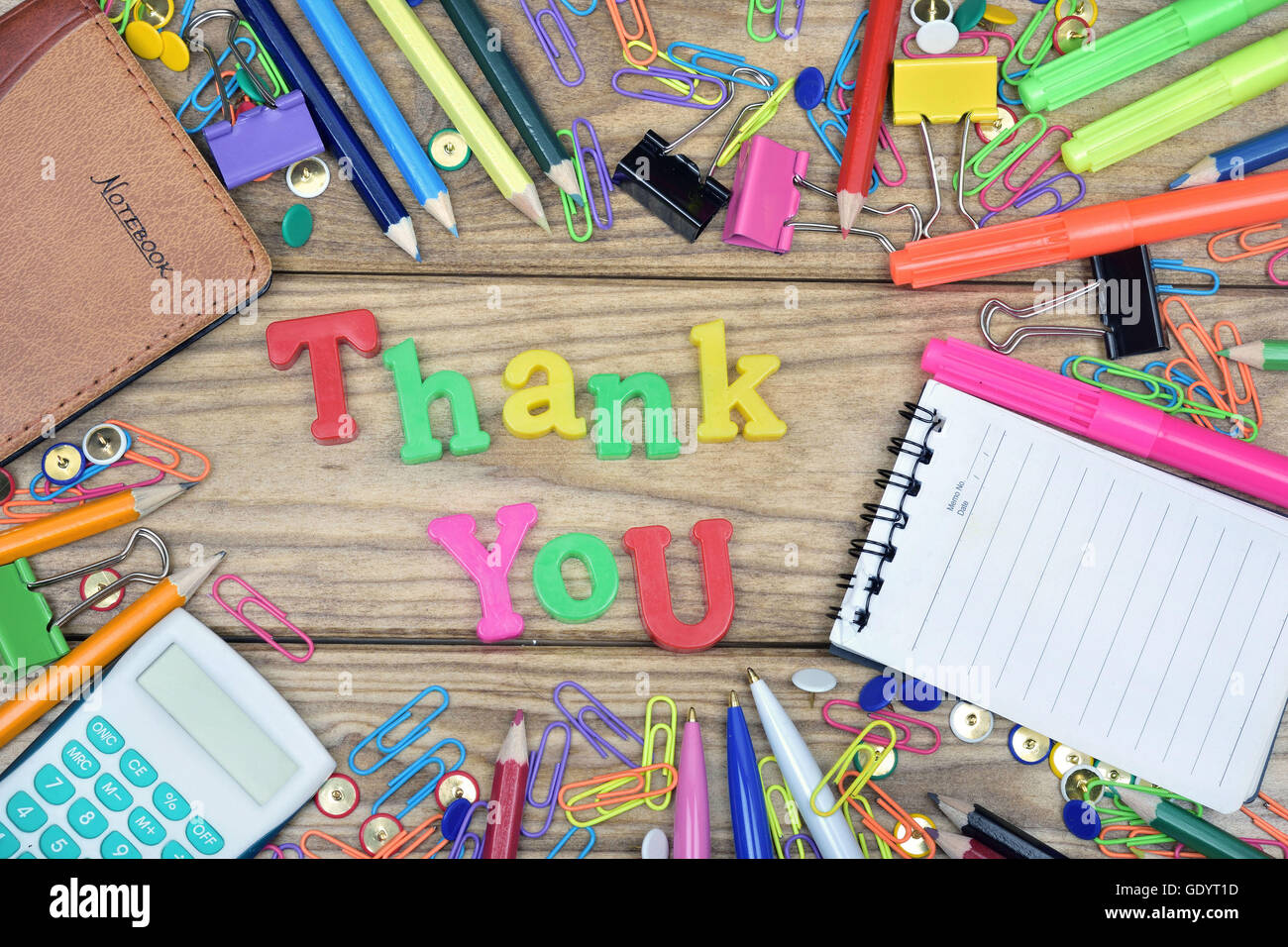 Thank You word and office tools on wooden table Stock Photo - Alamy