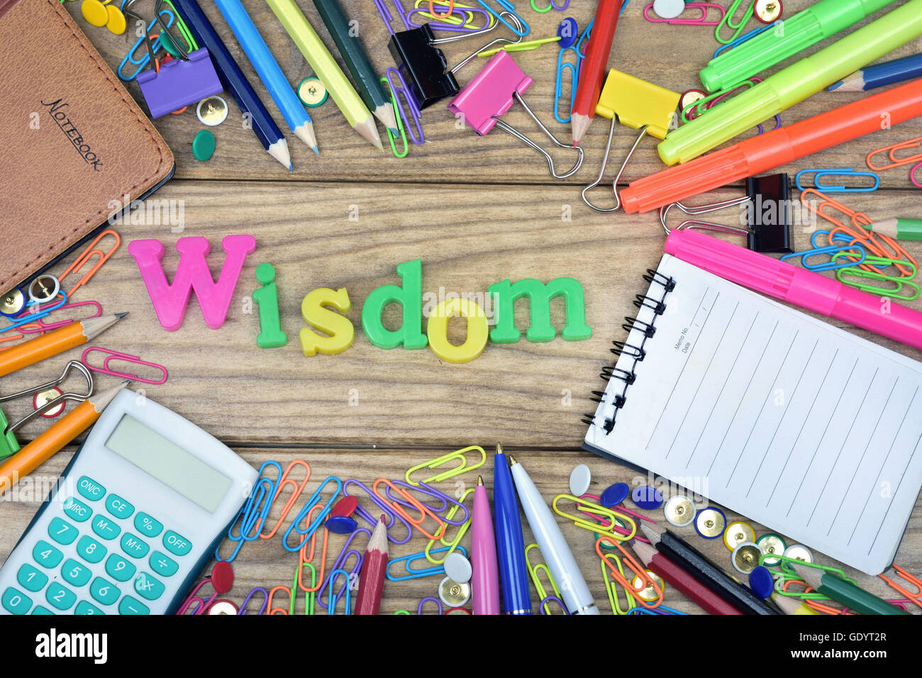 Wisdom word and office tools on wooden table Stock Photo - Alamy