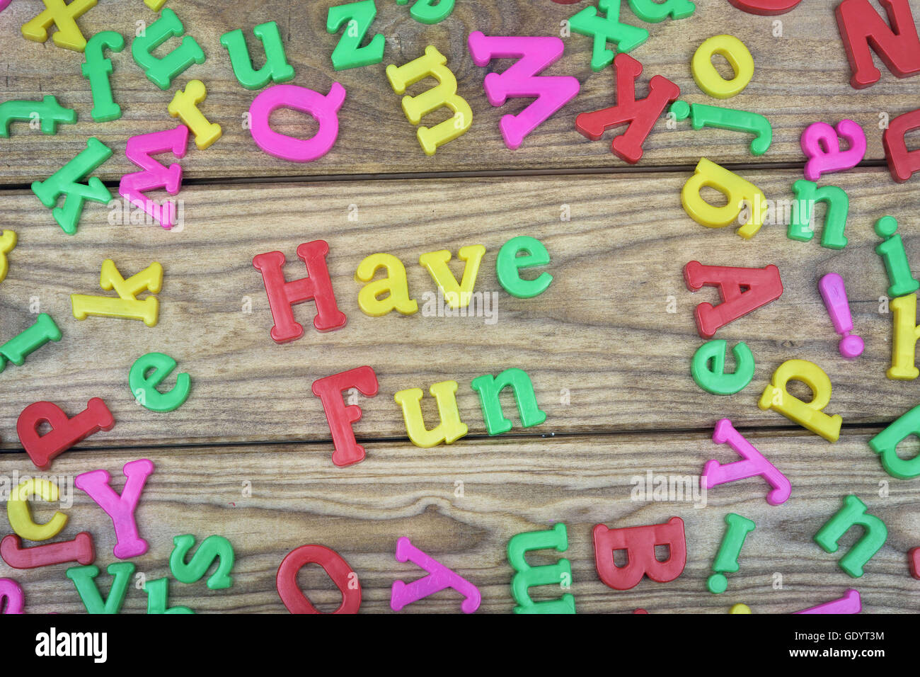 Have Fun word on wooden table Stock Photo - Alamy