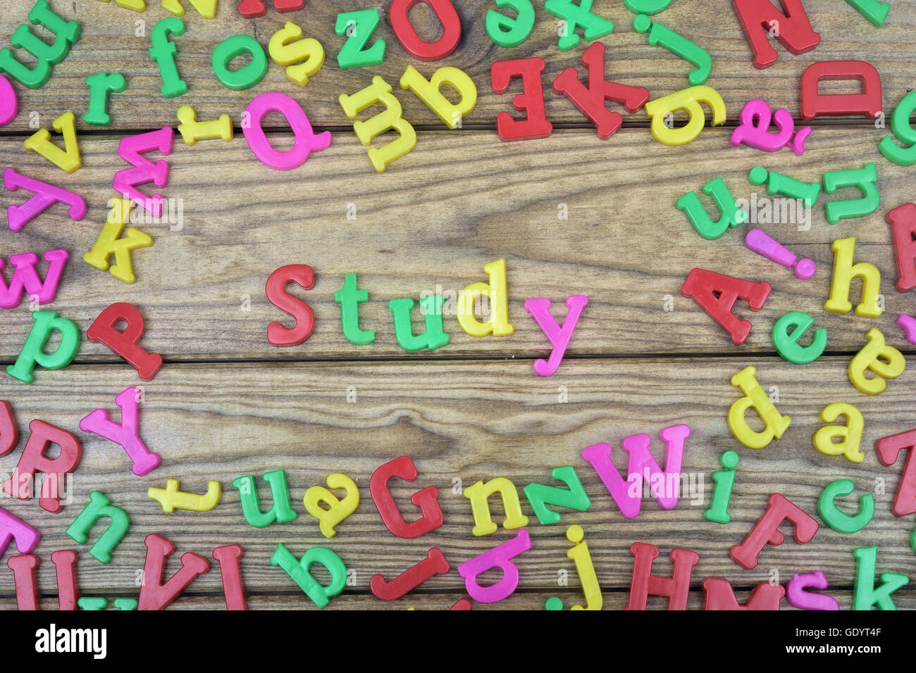 Study word on wooden table Stock Photo - Alamy