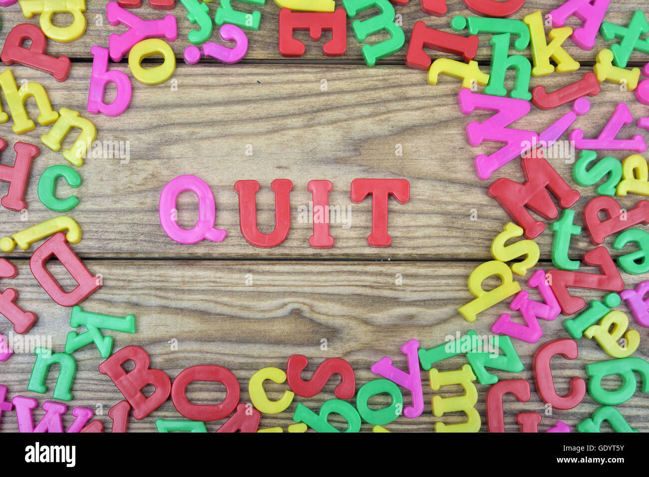 Quit word on wooden table Stock Photo - Alamy