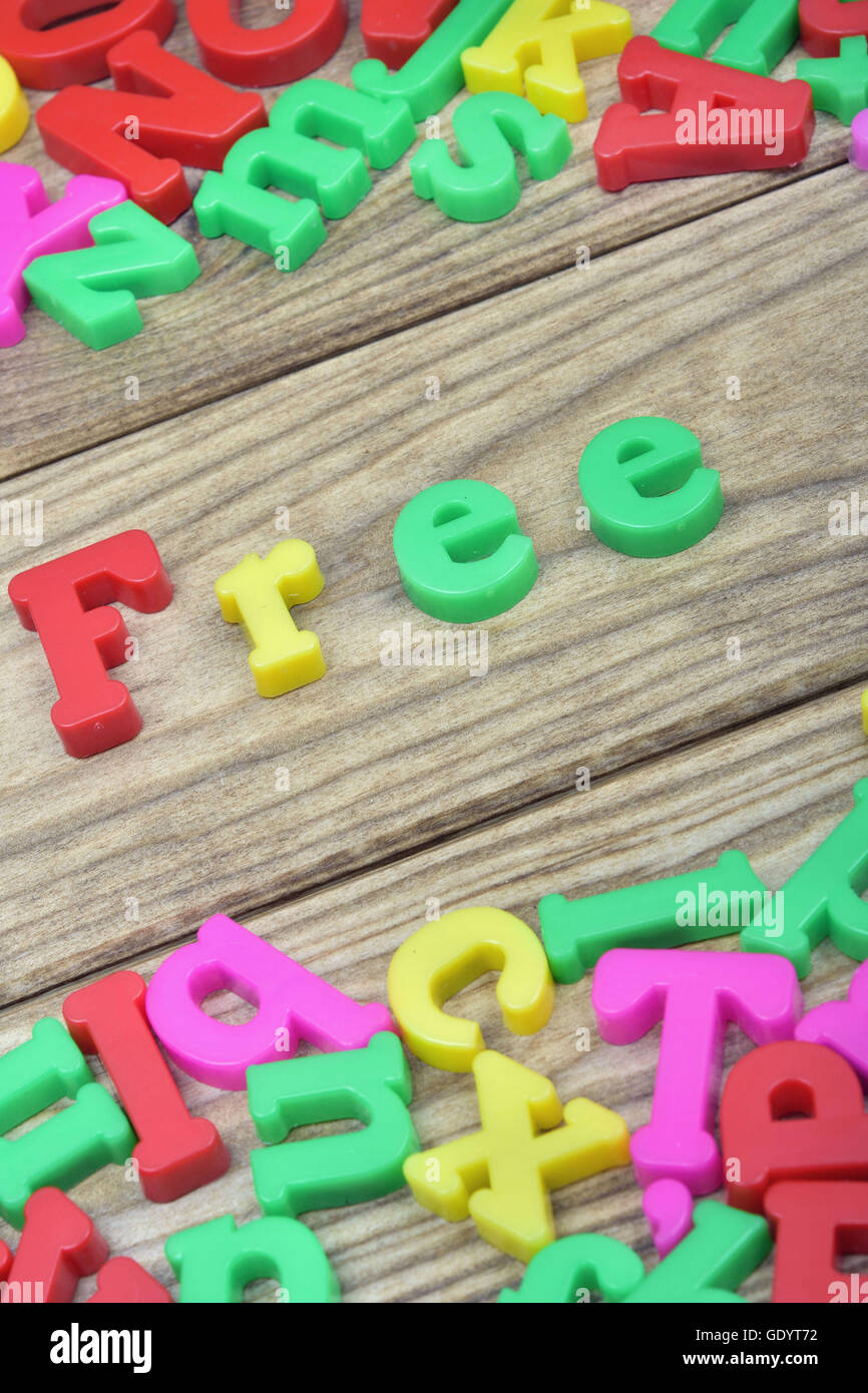 Free word on wooden table Stock Photo - Alamy