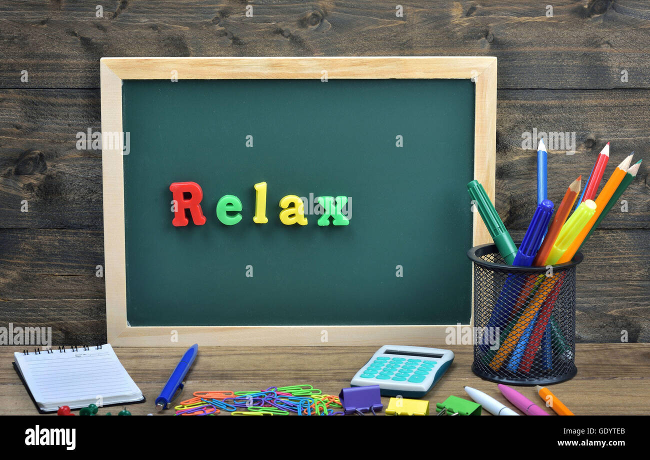 Relax word on school board Stock Photo - Alamy
